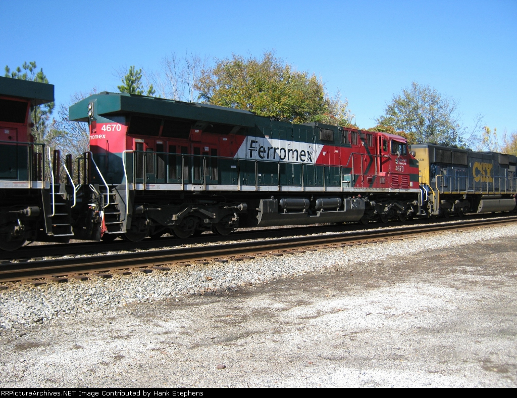 Rear shot of trailing FXE unit on Q601 leading four potential CSX units going to lease on FXE.